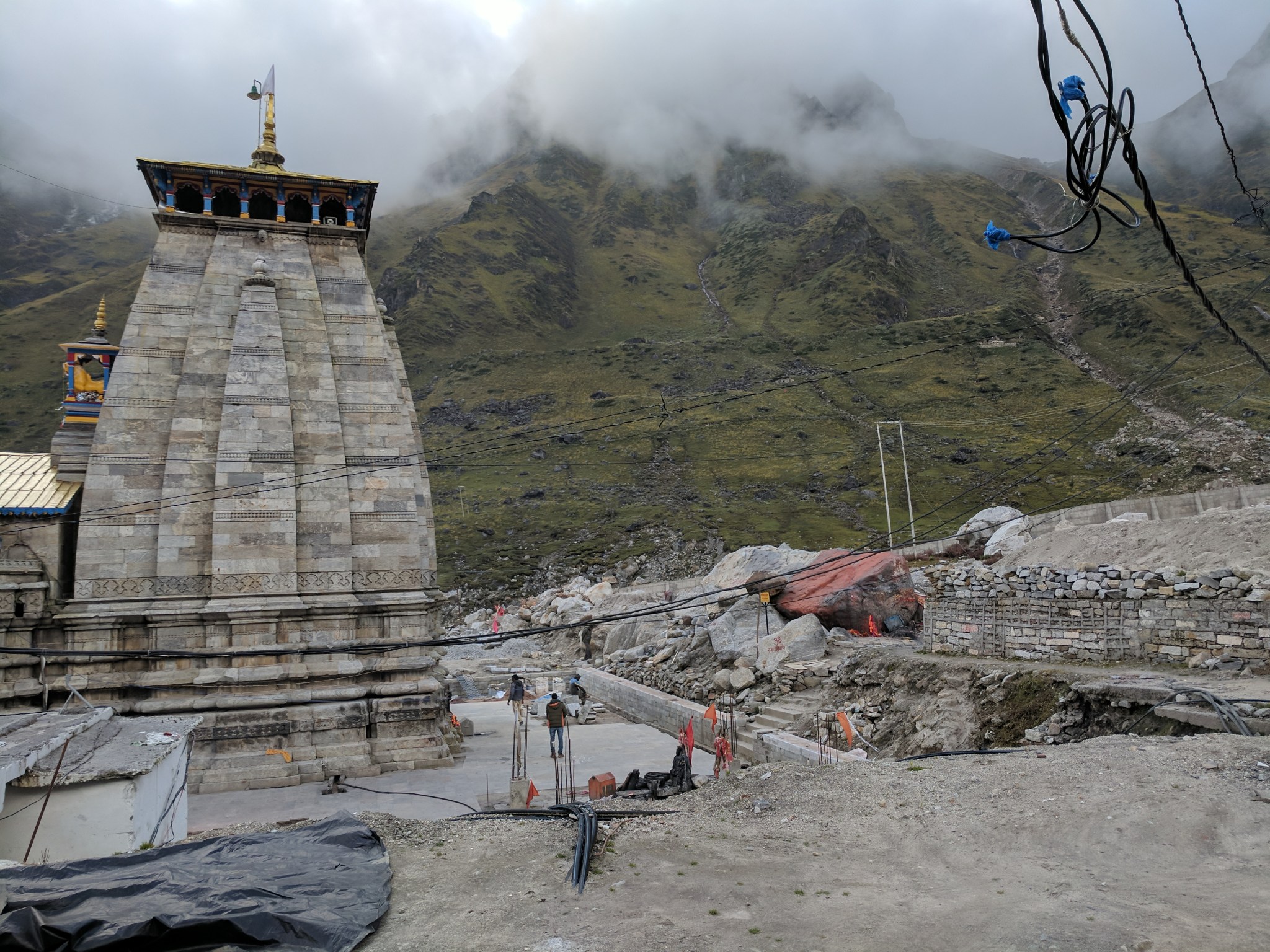 Side View of Kedarnath Temple with the red rock that protected the ...